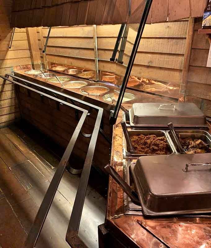 The buffet station where colonial-inspired dishes wait patiently for you to make multiple trips without shame.