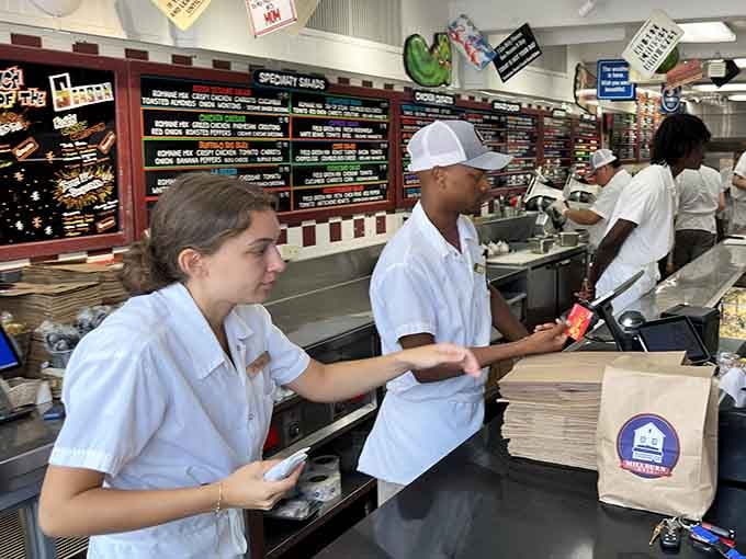 Behind every great sandwich is a dedicated team moving with the practiced rhythm of a well-rehearsed Broadway ensemble.