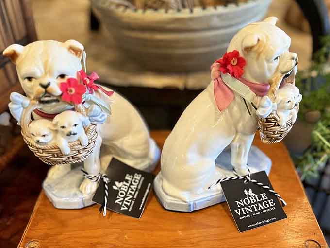 Ceramic pups carrying their own puppies, because vintage figurines never met a concept too precious to immortalize.