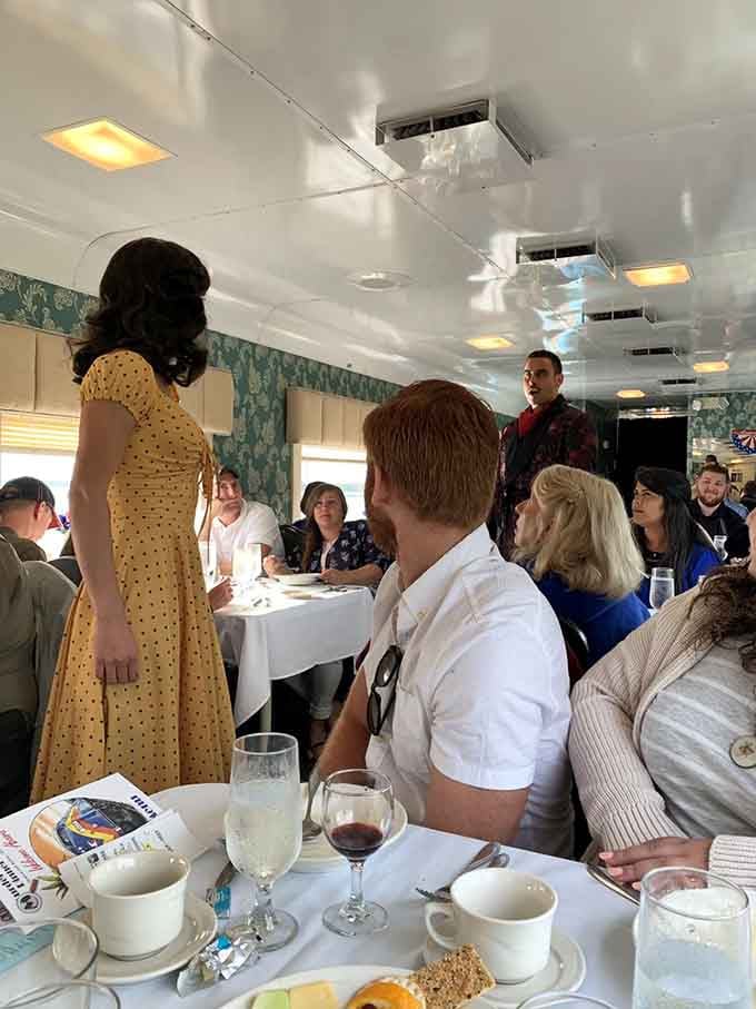 The actors bring serious commitment to their roles, moving through the aisles and engaging passengers in this delightfully immersive theatrical experience.