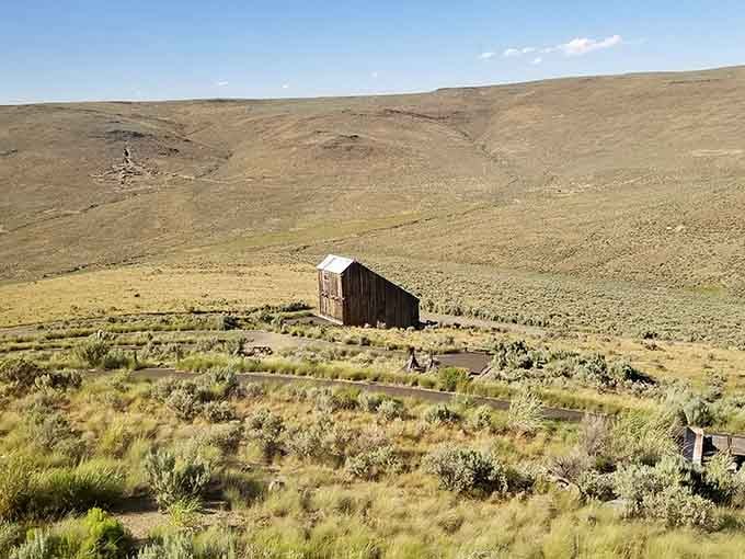 A weathered cabin sits alone in the sagebrush, looking exactly like every "fixer-upper" listing you've ever scrolled past.