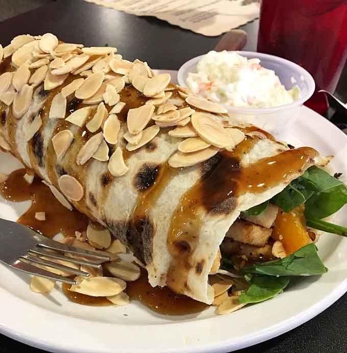 That spinach chicken wrap looks like lunch decided to get fancy without being pretentious about it.