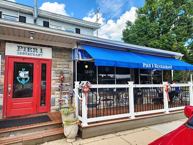 Pier 1 Restaurant's blue awning beckons like a lighthouse, promising waterfront views and seafood that actually tastes like the bay.