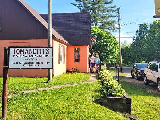 That orange cottage exterior practically glows with the promise of authentic Italian comfort food waiting inside for hungry travelers.