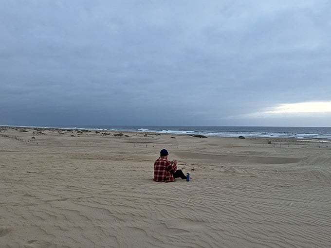 Solitude seekers find their zen on vast stretches of sand under moody coastal skies.