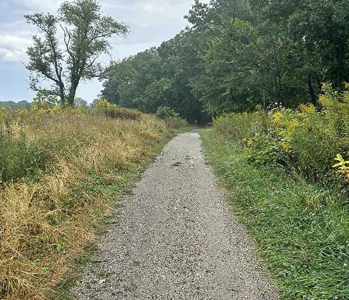 Gravel paths wind through open meadows where prairie grasses sway like they're auditioning for a movie.