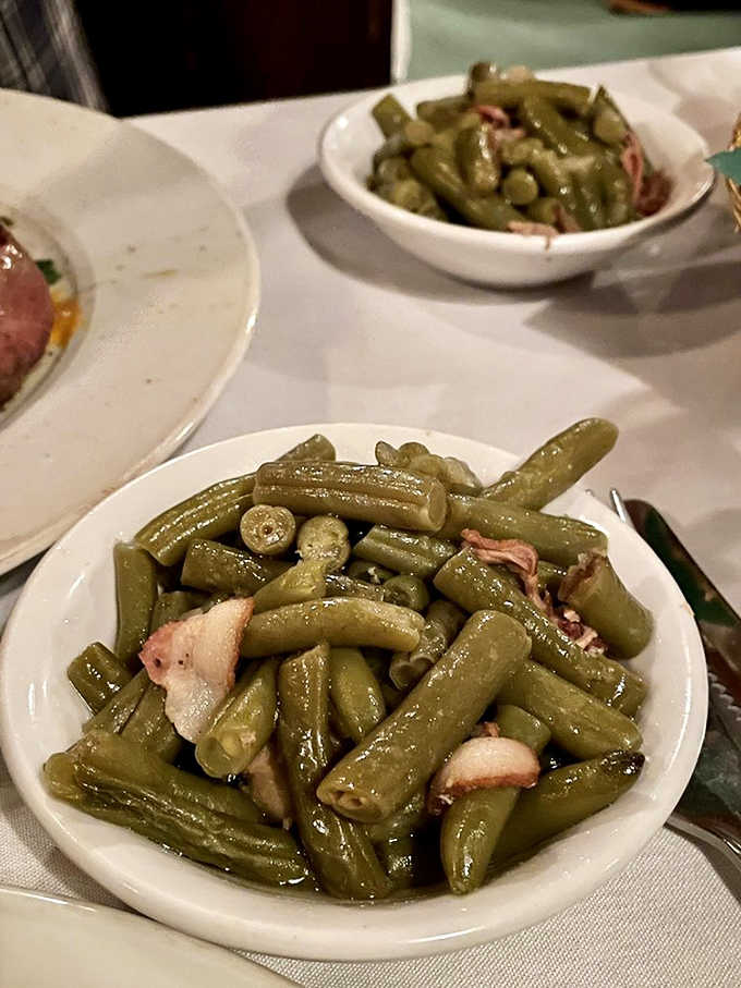 Green beans cooked Southern-style with bacon because vegetables taste better when pork gets involved in the conversation.