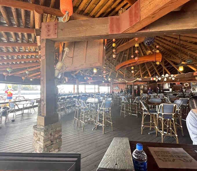 The interior proves someone took the tiki theme seriously, then doubled down with more bamboo and surfboards.