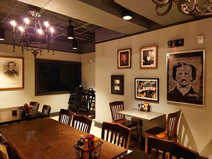 Framed Poe portraits and vintage chandeliers transform this dining room into a cozy tribute to American Gothic literature.