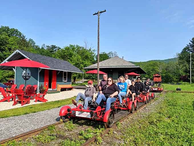 The whole crew ready to roll from the charming depot, where mountain adventures begin with smiles and comfortable seats.