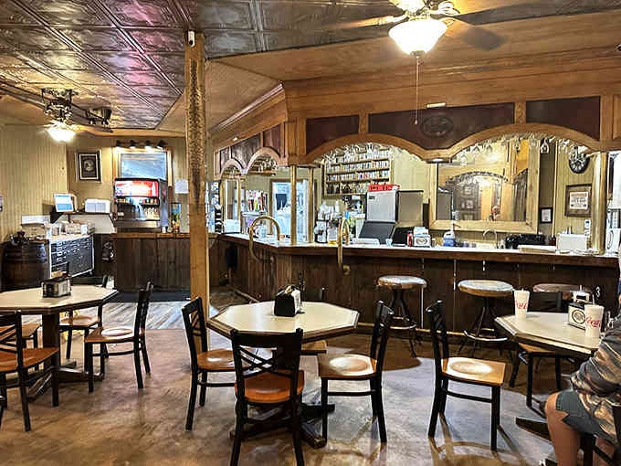The full bar setup inside the cave features wooden accents and vintage touches that would make any Old West saloon jealous.