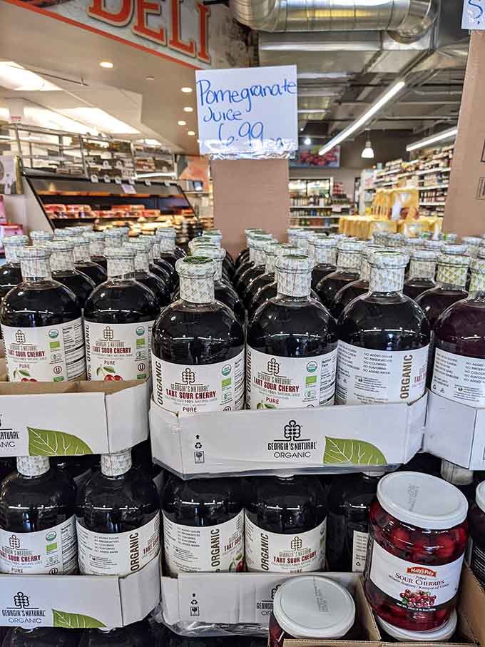 Pomegranate juice bottles lined up like ruby-red soldiers, each one packed with more antioxidants than a health magazine.