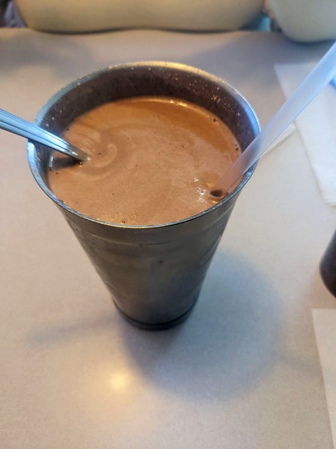 The chocolate shake arrives thick enough to stand a spoon in, exactly as nature and the 1950s intended.