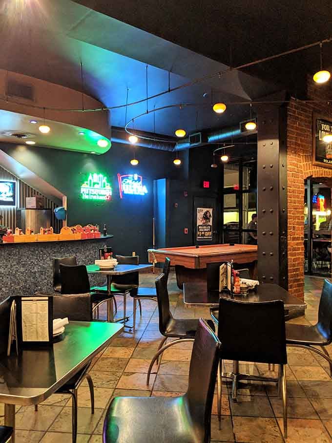 Neon signs and a pool table create that perfect neighborhood hangout energy where seafood meets serious fun.