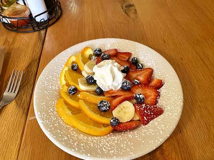 Fresh fruit arranged like a sunrise on your plate, proving that Saturday Morning Cafe takes presentation as seriously as flavor.