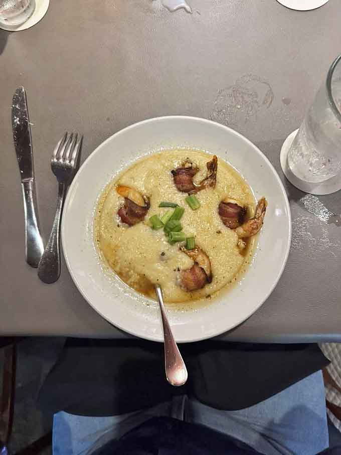 Shrimp and grits done right, with plump shrimp swimming in sauce that makes every creamy bite worth savoring slowly.
