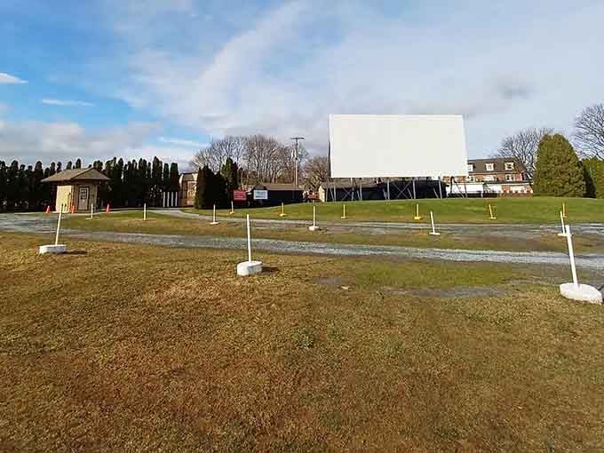 Rows of poles mark your parking spot, creating that distinctive drive-in landscape we all remember fondly.