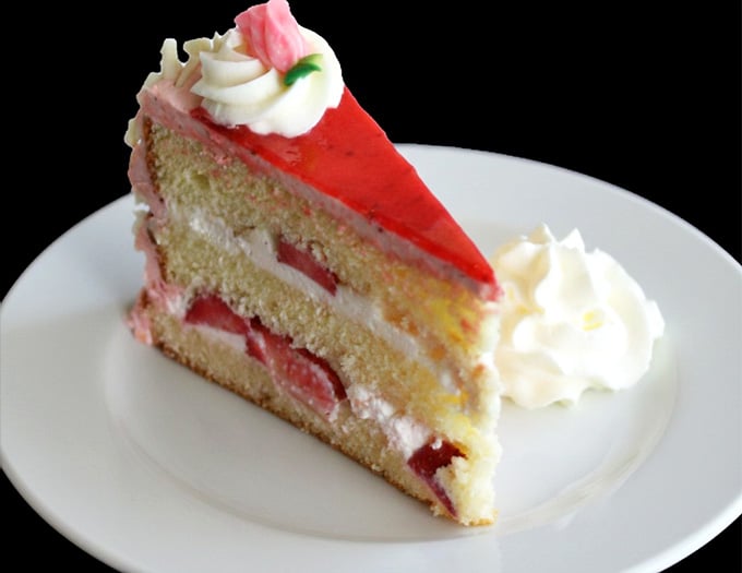 Layers of strawberry cake that look like they belong in a bakery window, not your neighborhood chicken joint.