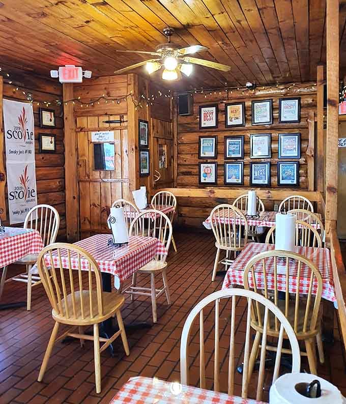 The warm glow of string lights and trophy-lined walls tells you this place has earned every accolade it displays.