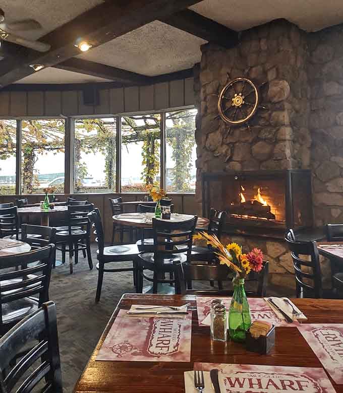 Stone fireplace, lake views, and cozy seating that makes you want to cancel all your plans and just stay forever.