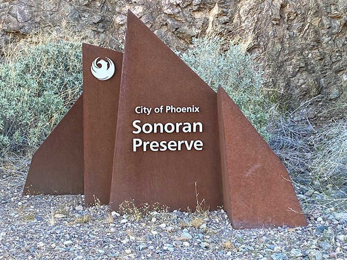 The preserve's distinctive signage marks your entry into one of Phoenix's most treasured natural spaces, rust-colored and welcoming.