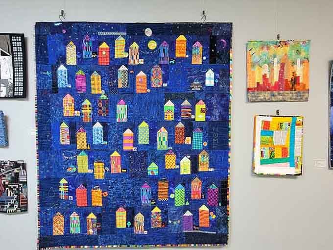 A nighttime cityscape rendered entirely in fabric, because why should painters have all the fun?