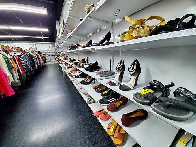 Shoes displayed salon-style on white shelves, from sensible flats to heels that mean serious business or parties.