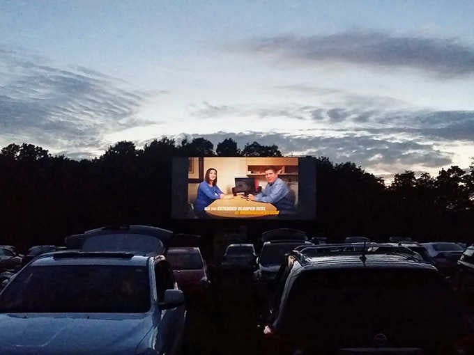 As darkness falls, the screen glows to life while moviegoers settle in for entertainment that never required a password.