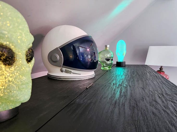 Space helmets and alien figurines scattered throughout prove someone here takes their extraterrestrial hospitality very seriously indeed.