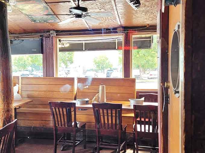 Wooden booths and windows looking out create the perfect spot for a leisurely lunch or dinner date.