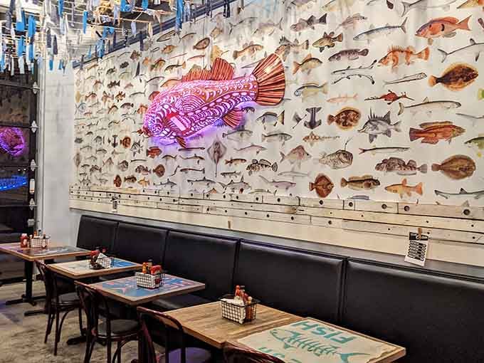 A stunning fish-covered wall transforms dining into an underwater adventure without requiring scuba certification or getting wet.