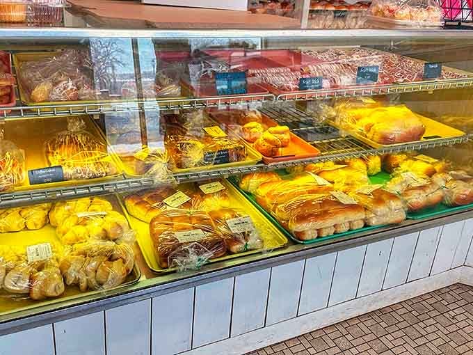 Bread stacked like golden bricks, building dreams one loaf at a time for carbohydrate enthusiasts everywhere.