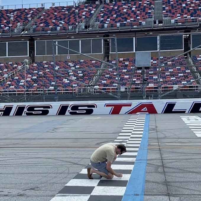 Someone's getting up close and personal with the start-finish line, living their best checkered flag fantasy right now.