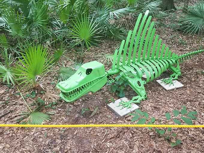 A bright green dimetrodon sculpture that's cheerful enough to make extinction seem less depressing somehow.