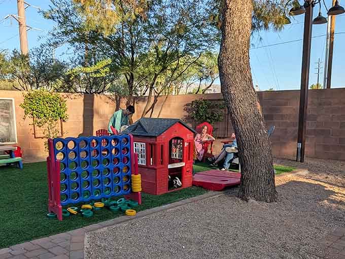 Giant Connect Four and a playhouse mean the kids stay entertained while parents enjoy their meal peacefully.