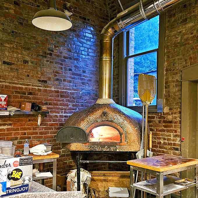 That gleaming wood-fired oven isn't just equipment, it's the beating heart that transforms good ingredients into extraordinary pizza magic.