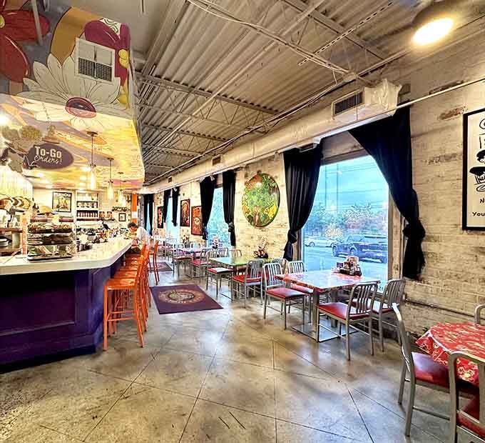 Exposed brick and whimsical ceiling art give this dining room the relaxed charm of your favorite neighborhood hangout.