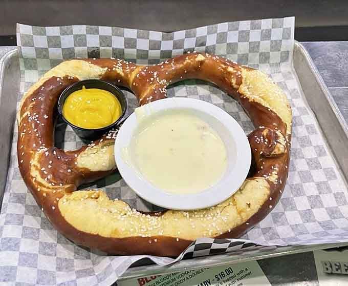 A pretzel so large it needs its own zip code, served with dipping sauces for maximum carb-loading potential.