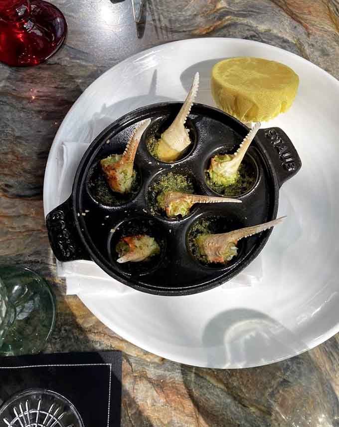 Crab escargot served in classic style, because sometimes tradition and innovation make the most delicious marriage of flavors.