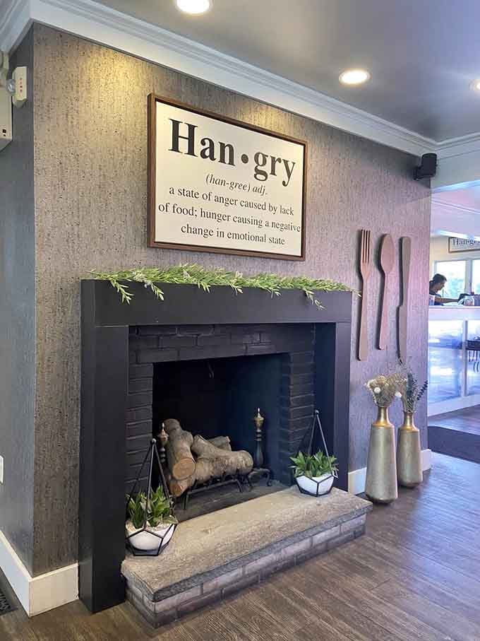 That fireplace and "hangry" definition sign perfectly capture the restaurant's welcoming personality and clever sense of humor.