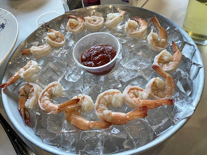 Cocktail shrimp on ice, arranged like edible jewels for people who appreciate the finer things in crustacean form.
