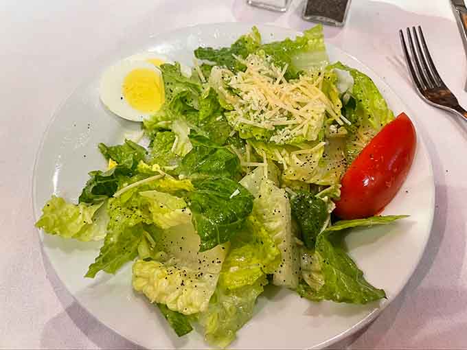 A Caesar salad with that perfect egg and fresh parmesan proves simplicity done right beats complexity done wrong.
