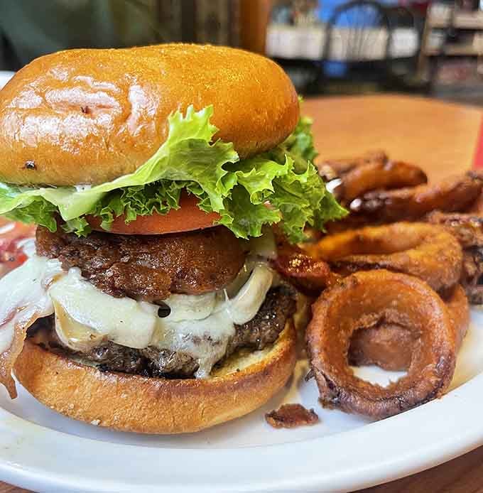 That juicy burger with melted Swiss and crispy onion rings could convert any breakfast purist.
