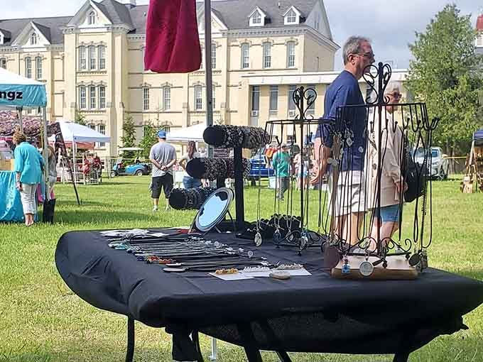 Artisan vendors displaying their wares on the lawn – it's like a farmers market decided to get fancy.