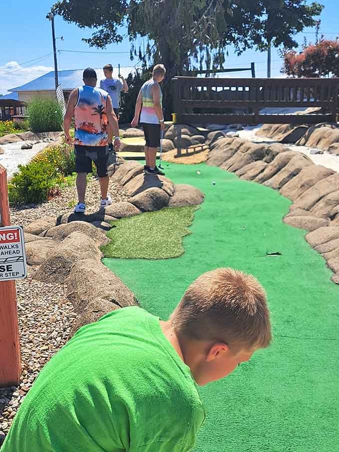 Navigating the mini golf course requires concentration, skill, and accepting that kids will beat you.
