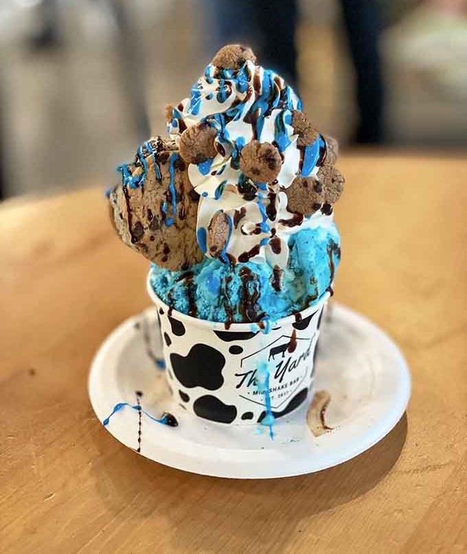 Vivid blue ice cream, cookie crumbles, and chocolate drizzle, the Cookie Monster sundae is pure childhood joy in a cup.