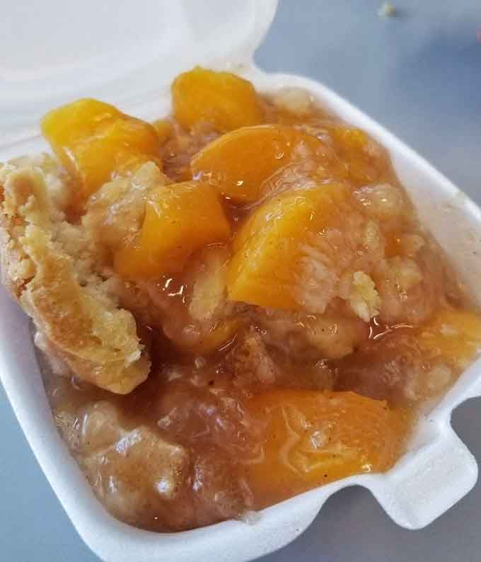 Peach cobbler that looks like summer sunshine decided to become dessert and succeeded spectacularly at the job.