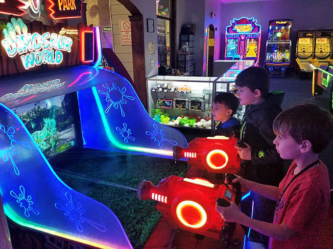 Dinosaur-themed arcade games add prehistoric excitement to this modern driving education experience for adventurous young visitors.