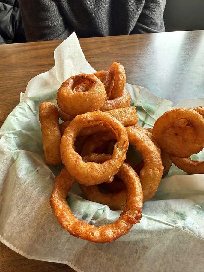 These onion rings have achieved that perfect golden ratio of crispy coating to sweet, tender onion inside.