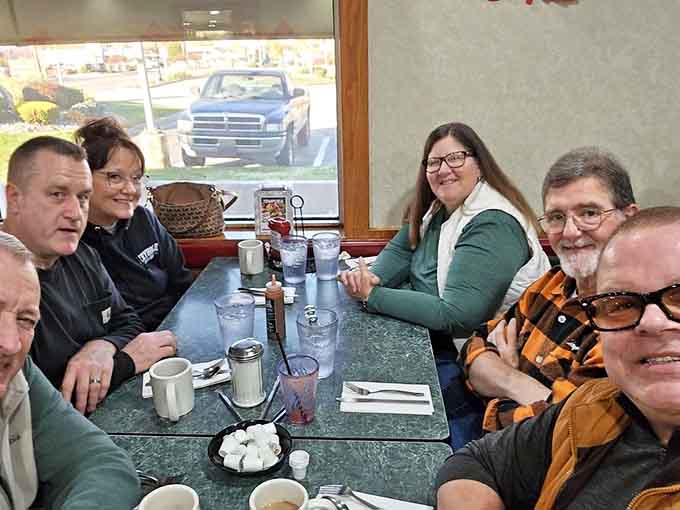The universal language of happiness: good people gathered around good food in a booth that's seen a thousand stories.